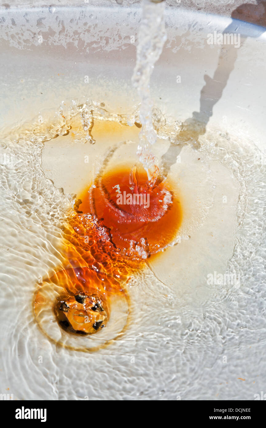 Rusty water pours from tap hi-res stock photography and images - Alamy