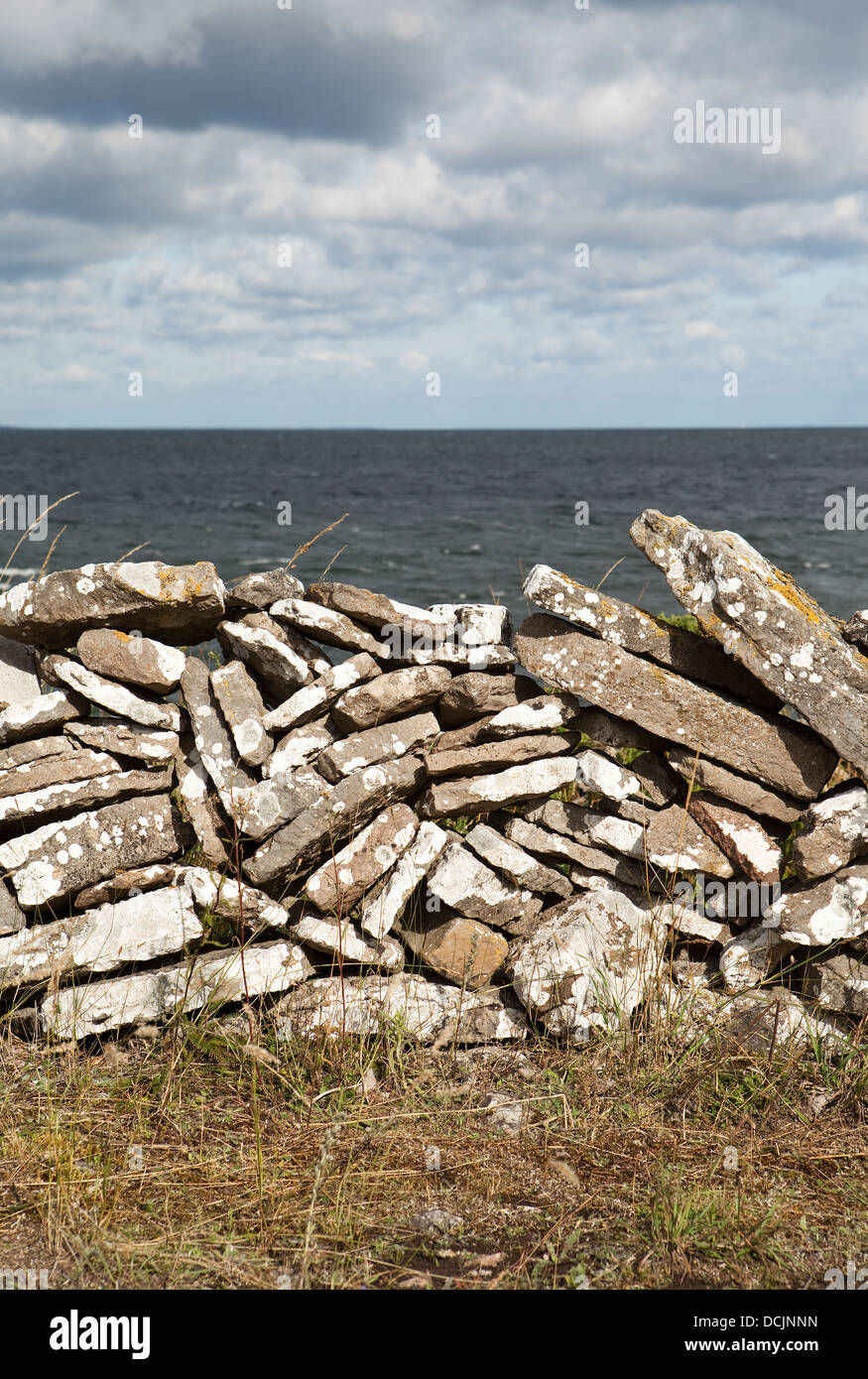 Stone wall by the ocean Stock Photo - Alamy