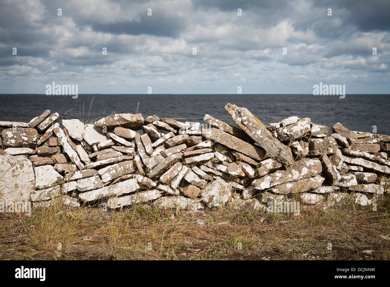Stone wall by the ocean Stock Photo - Alamy