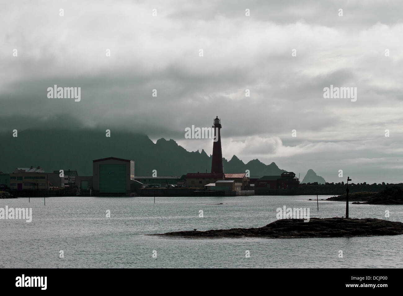 Lighthouse at harbor entrance, arctic Norway Stock Photo - Alamy