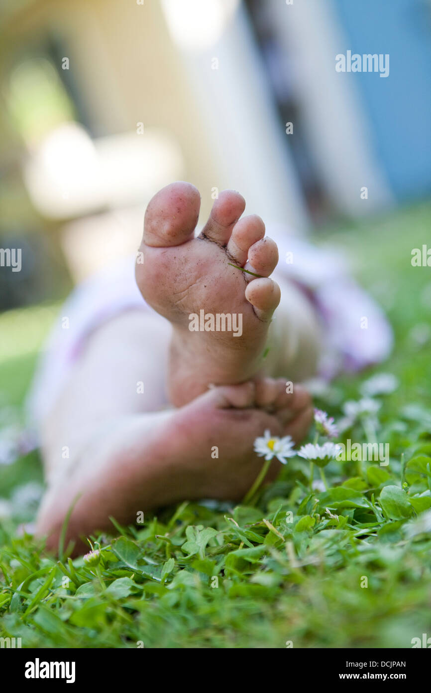 Feet in the grass Stock Photo - Alamy