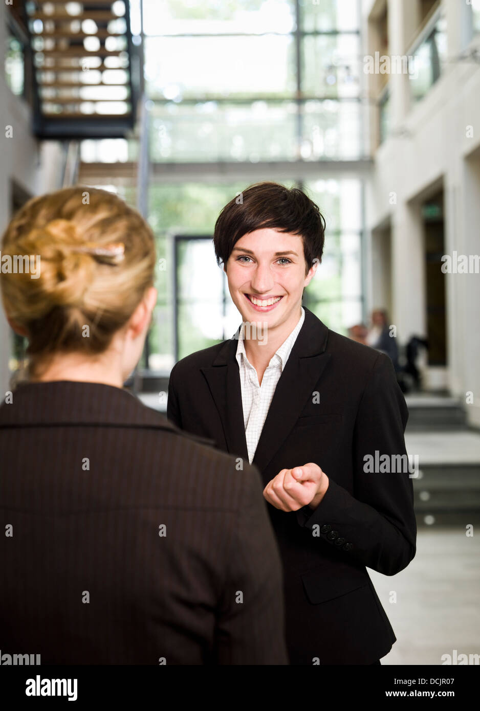 Two women in a conversation Stock Photo - Alamy