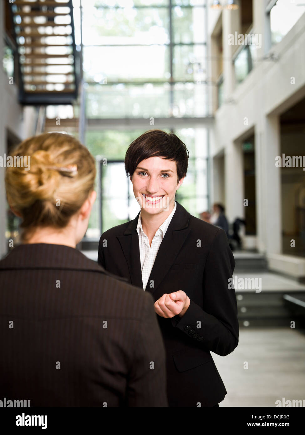 Two women in a conversation Stock Photo - Alamy