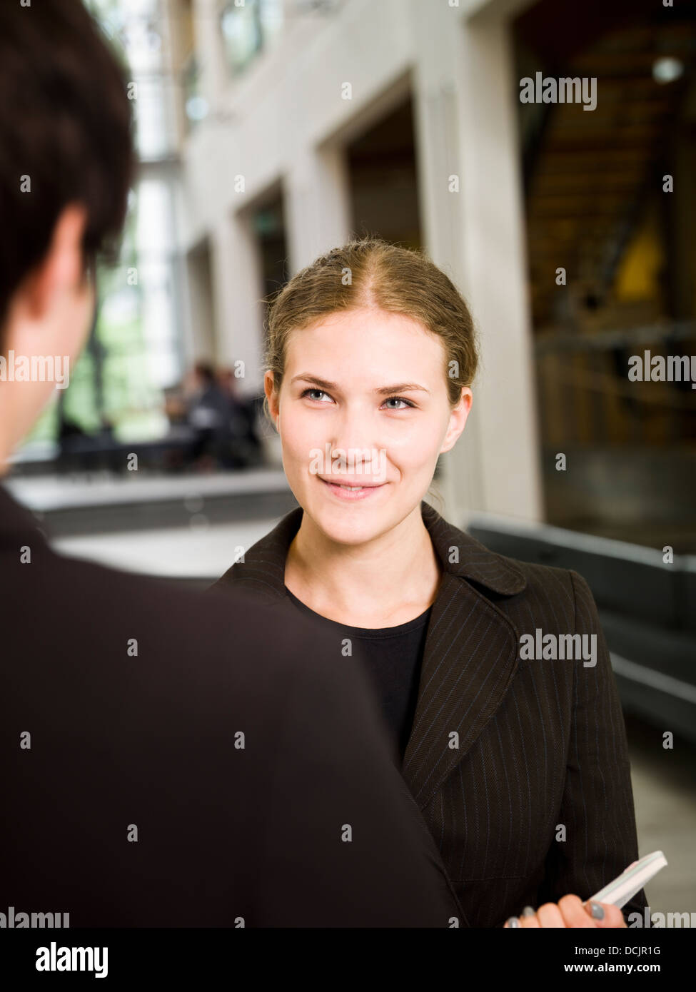 Two women in a conversation Stock Photo - Alamy