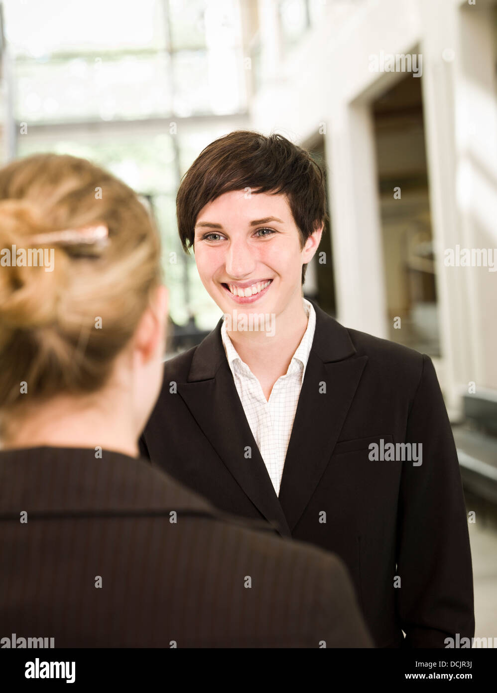 Two women in a conversation Stock Photo - Alamy