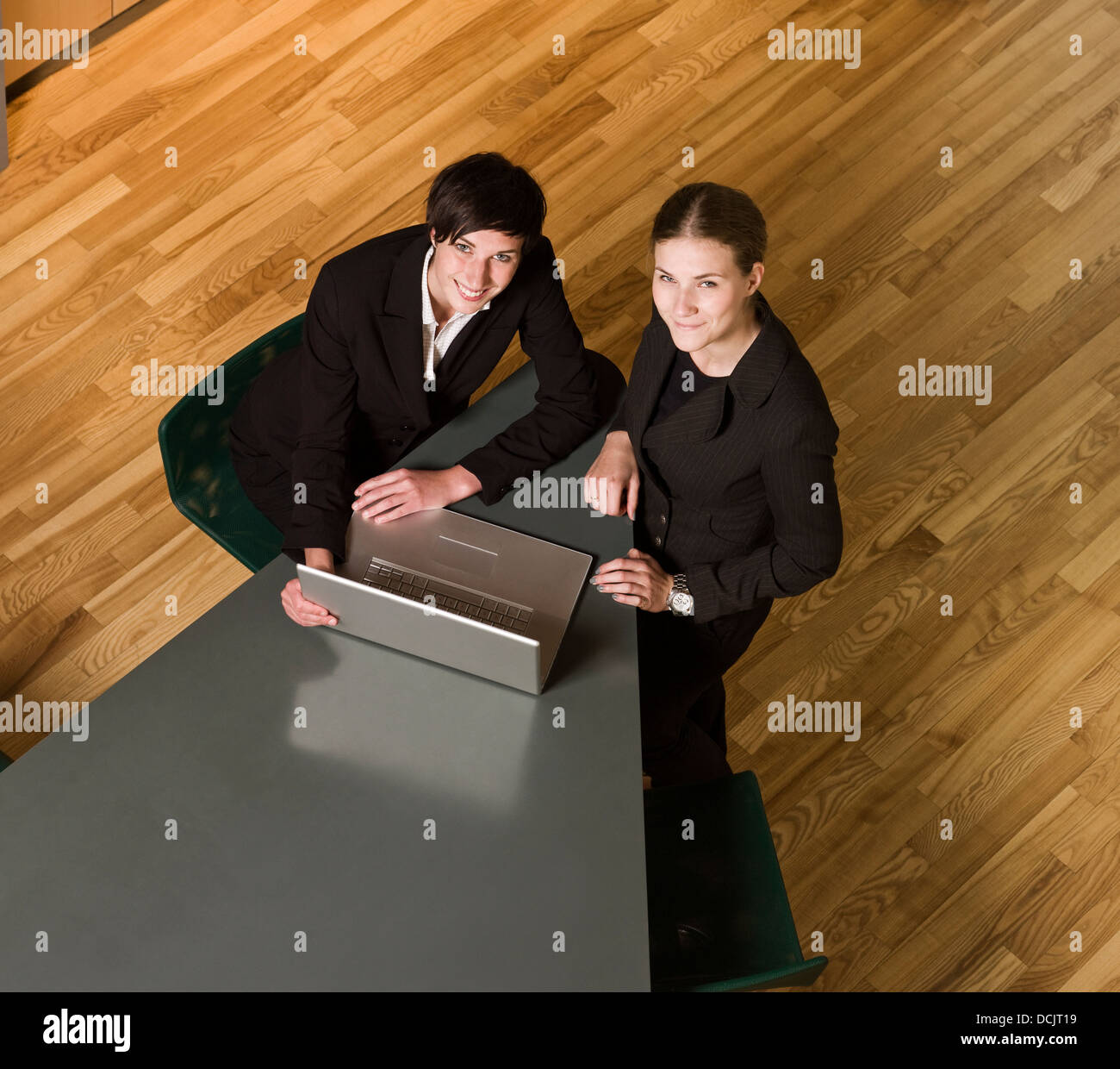 Two women from above with a computer Stock Photo - Alamy