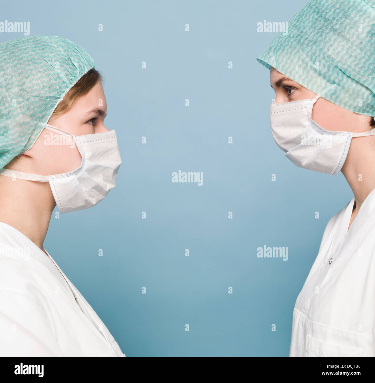 Two nurses with surgical masks Stock Photo - Alamy
