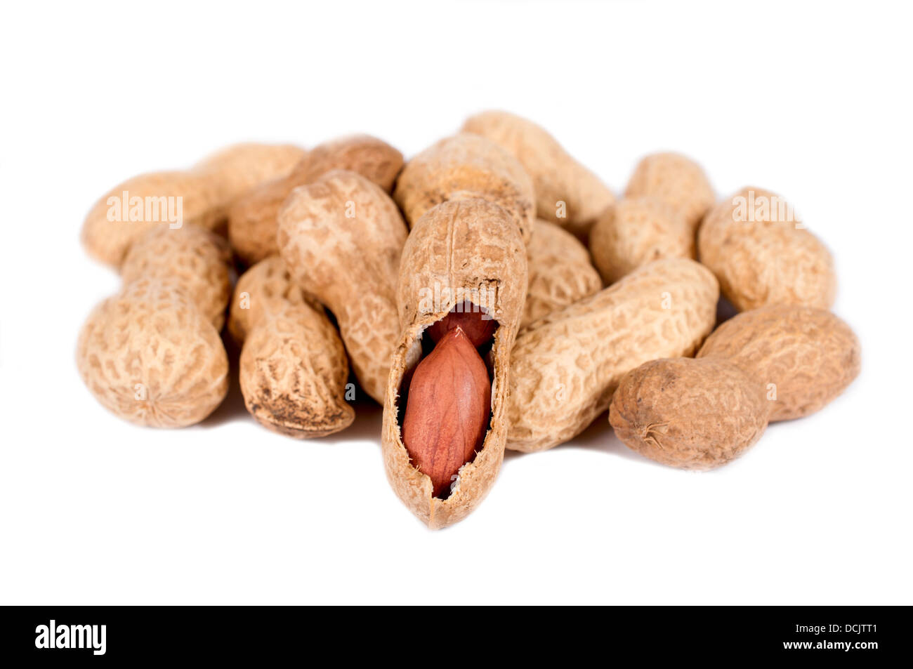 Raw peanuts in shell isolated on white background Stock Photo - Alamy