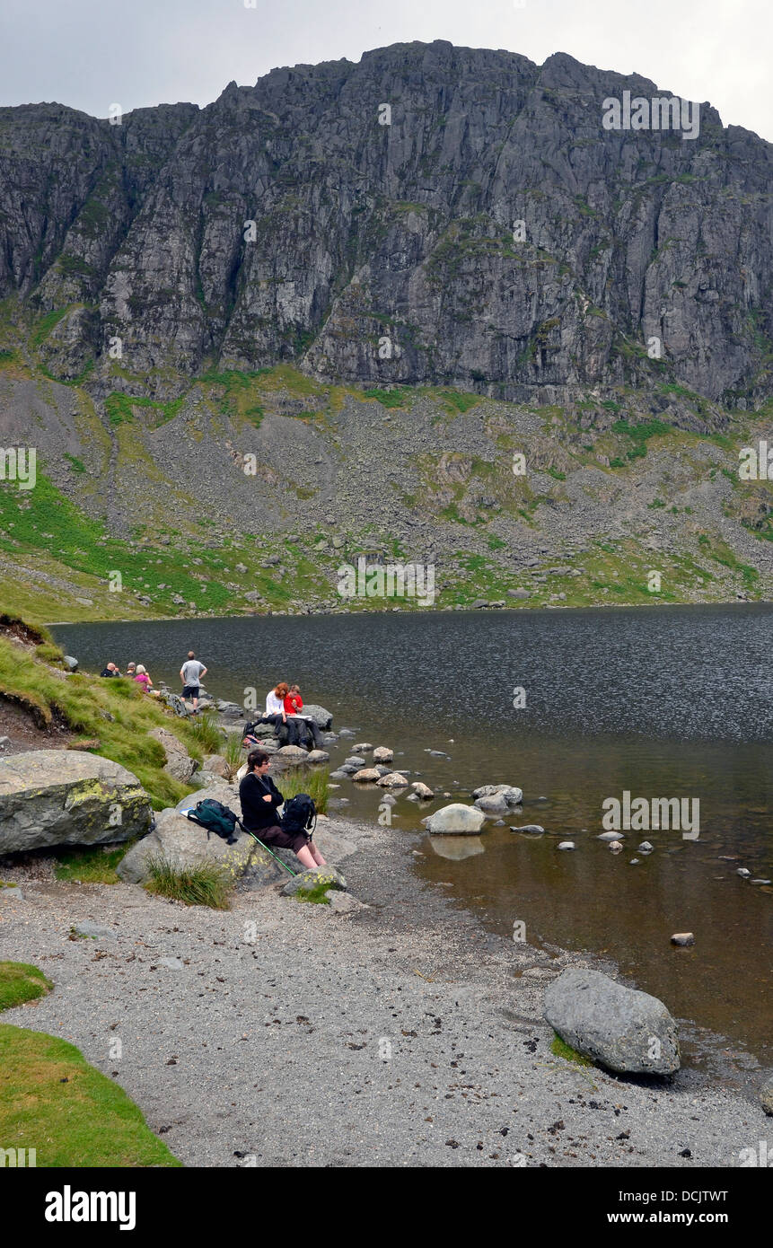 Pavey Ark crag behind Stickle Tarn, popular tourist spot above the ...