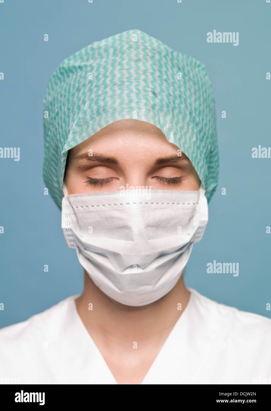 Nurse with her eyes closed Stock Photo - Alamy