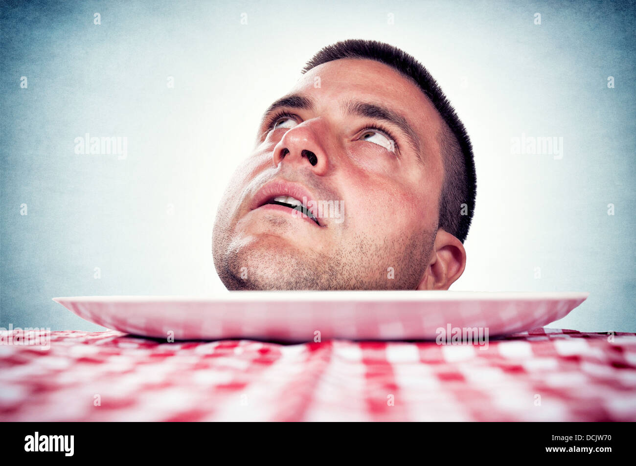 Death man with his head on the plate Stock Photo - Alamy