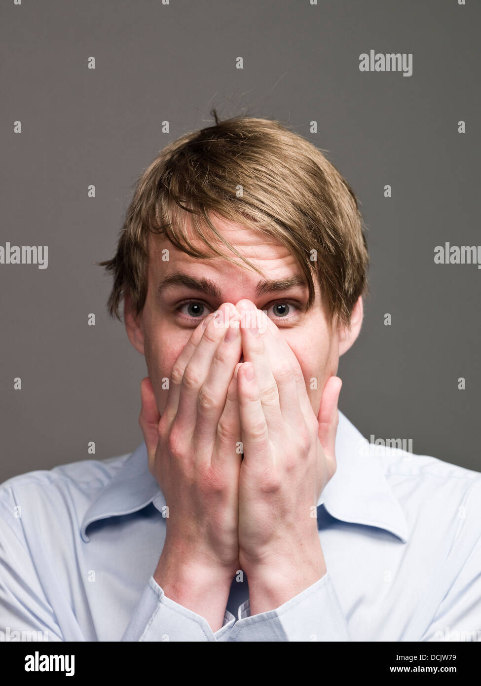 Portrait of a terrified man Stock Photo - Alamy