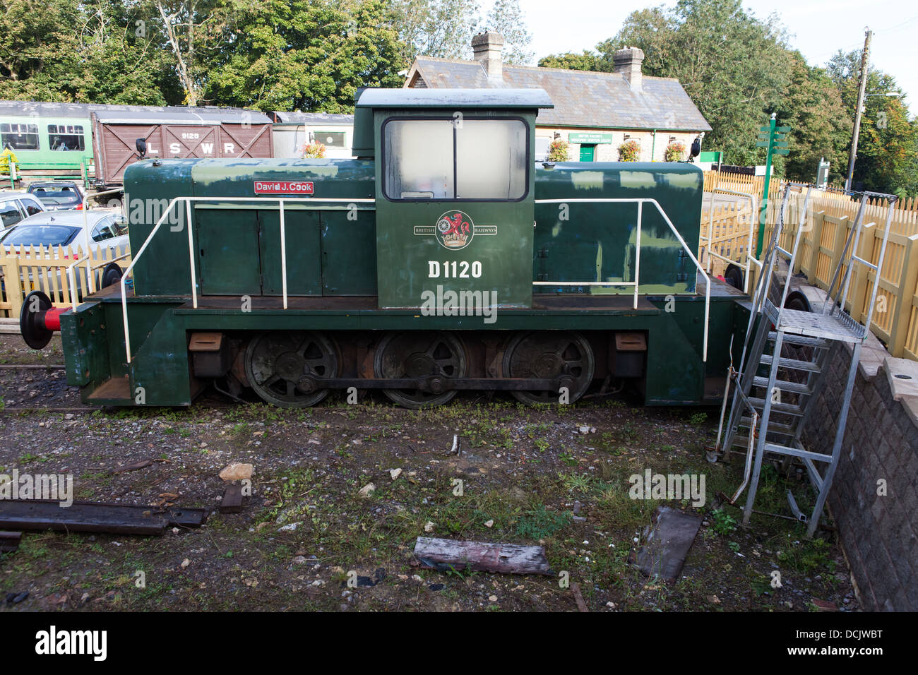 New Somerset and Dorset Railway, Midsomer Norton Station - an old green steam engine on display ...
