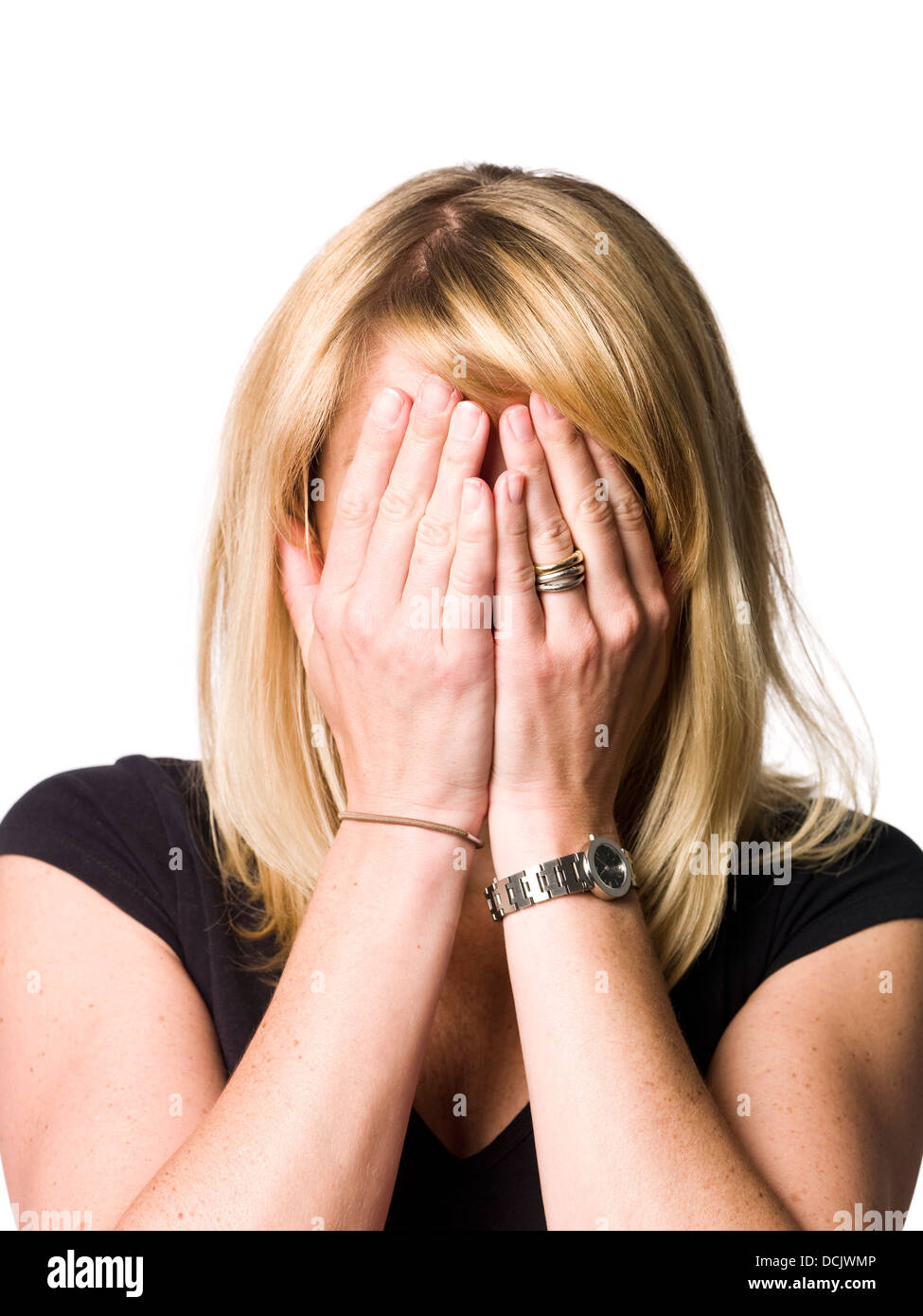 Portrait of a woman with her hands over her face Stock Photo - Alamy