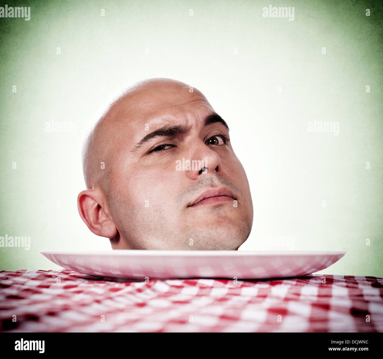 Bald man with his head on the plate Stock Photo - Alamy