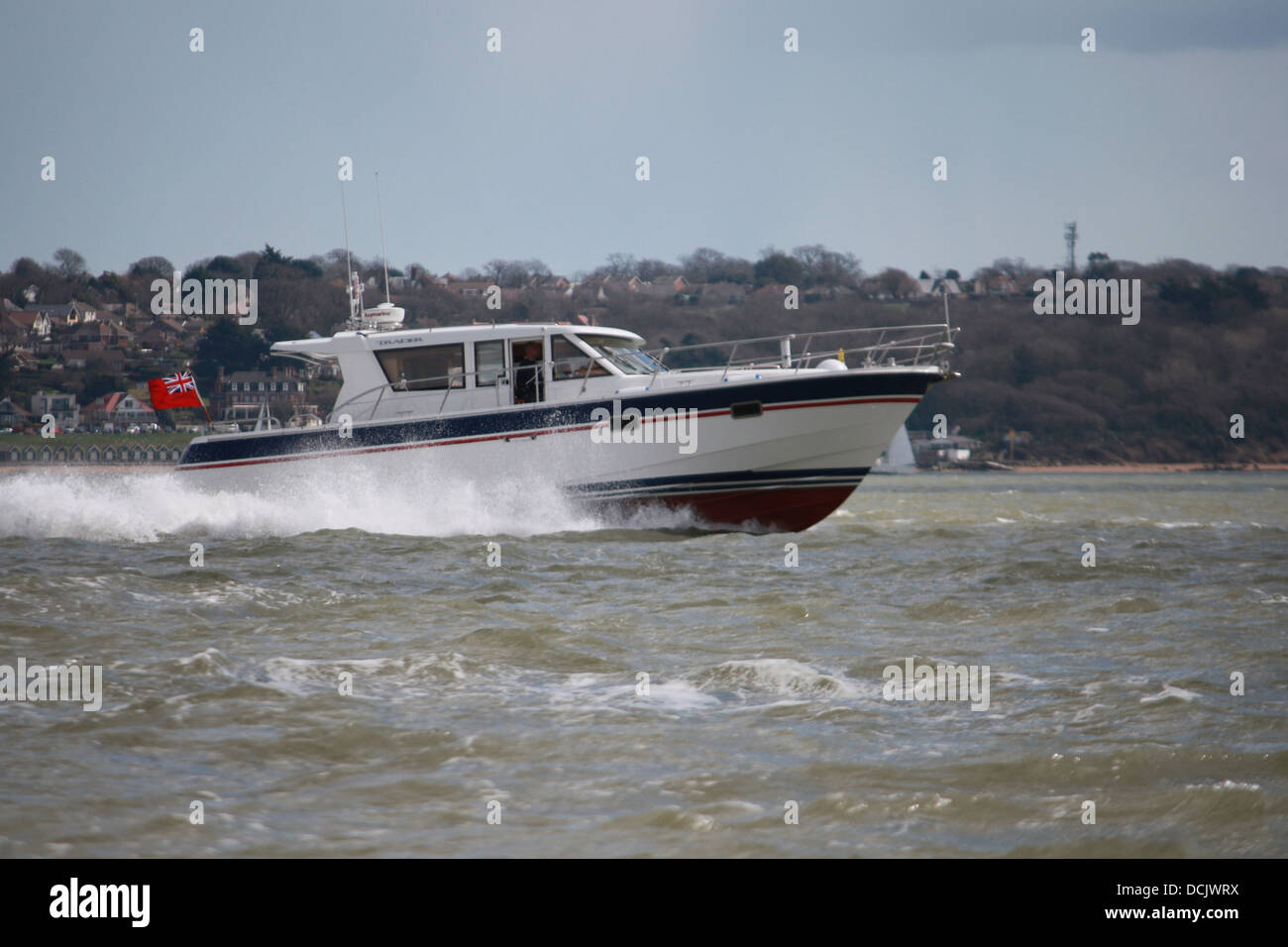 speedboat powering through waves on the solent Stock Photo - Alamy