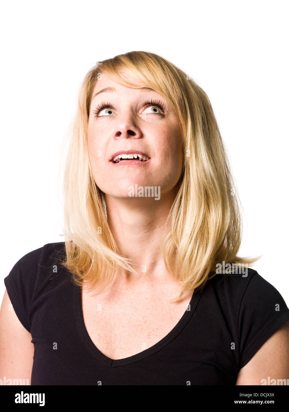 Portrait of a woman looking upwards Stock Photo - Alamy