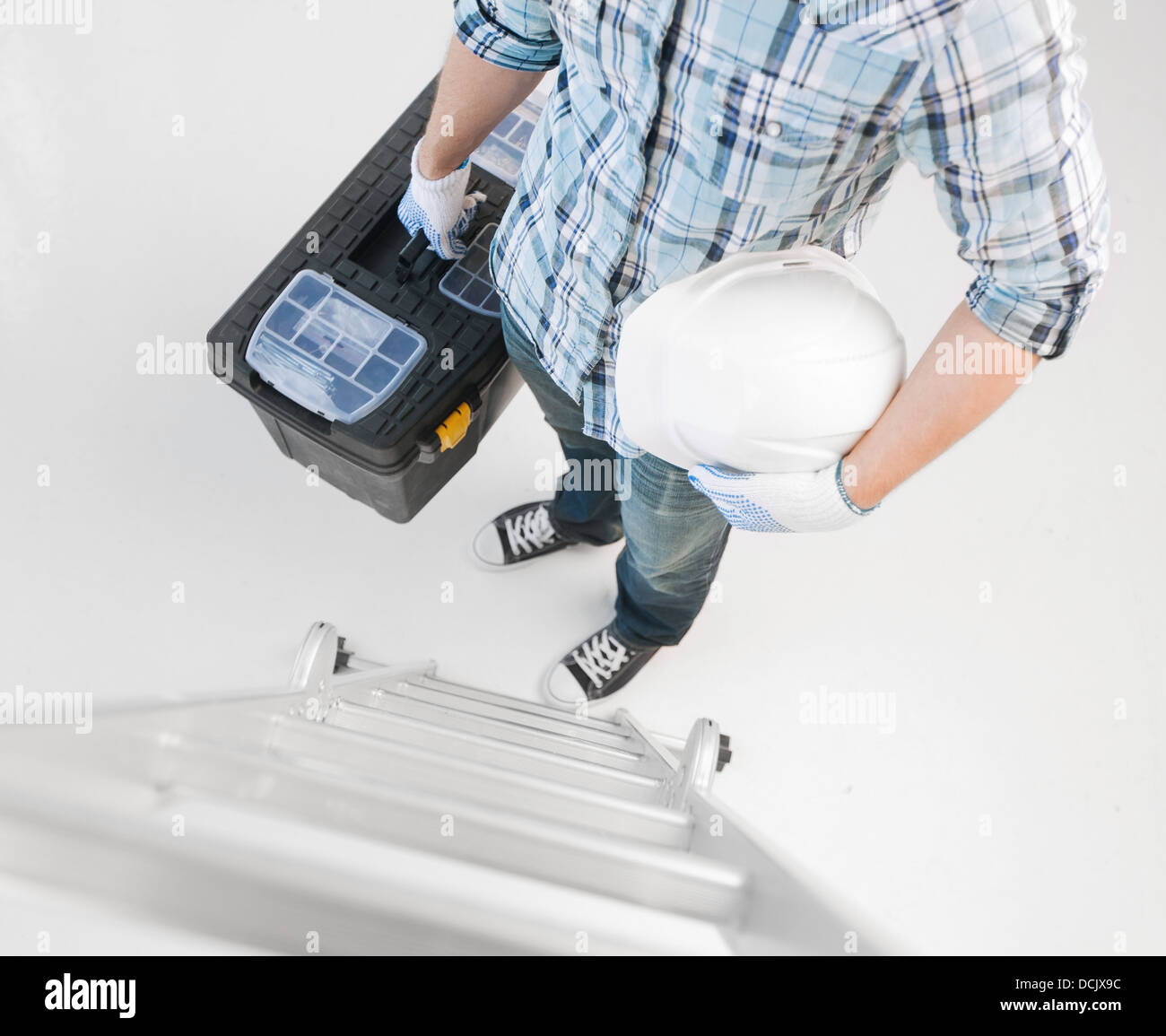 man with ladder, helmet and toolkit Stock Photo - Alamy