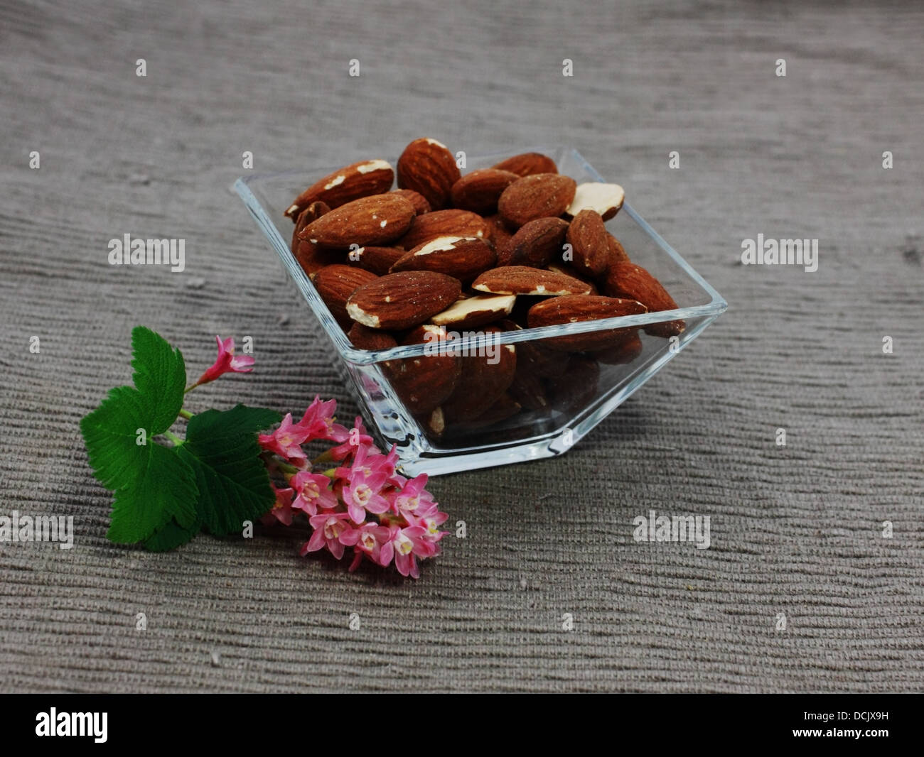 almond in a glass bowl Stock Photo - Alamy