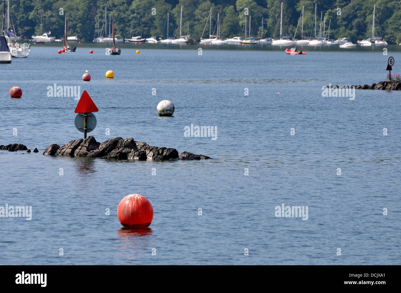 Marker buoys and dangerous rocks near islands on lake Windermere warn ...