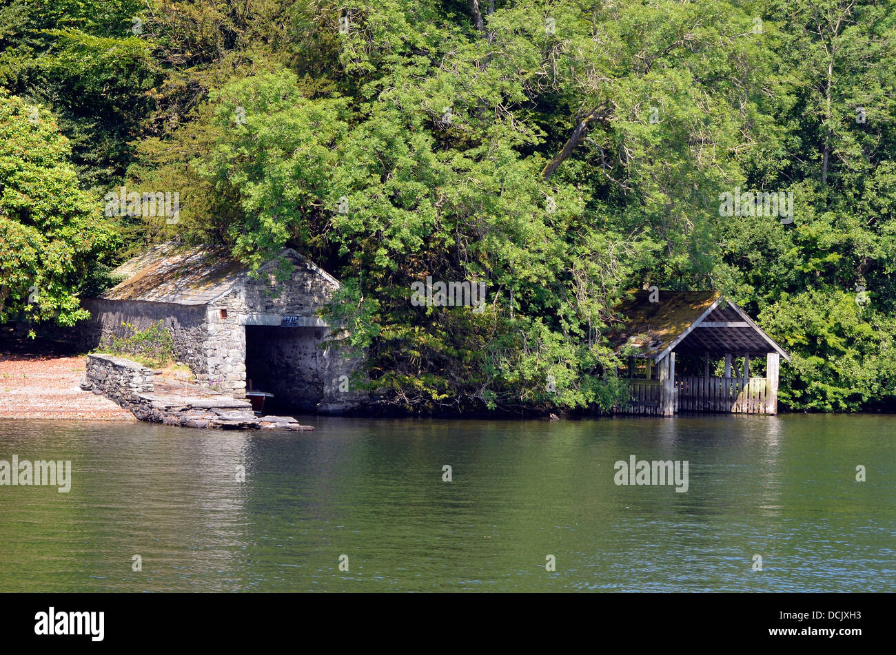 Traditional stone and timber boathouses on the shore of Lake Windermere ...