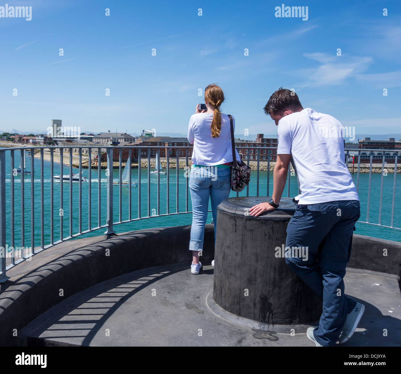 Young couple watching boats hi-res stock photography and images - Alamy