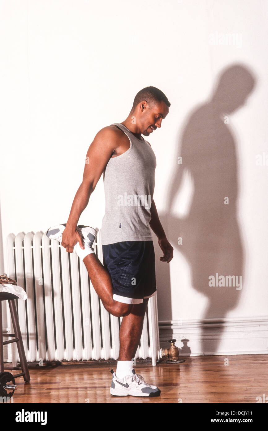 Black male stretching before work out Stock Photo - Alamy