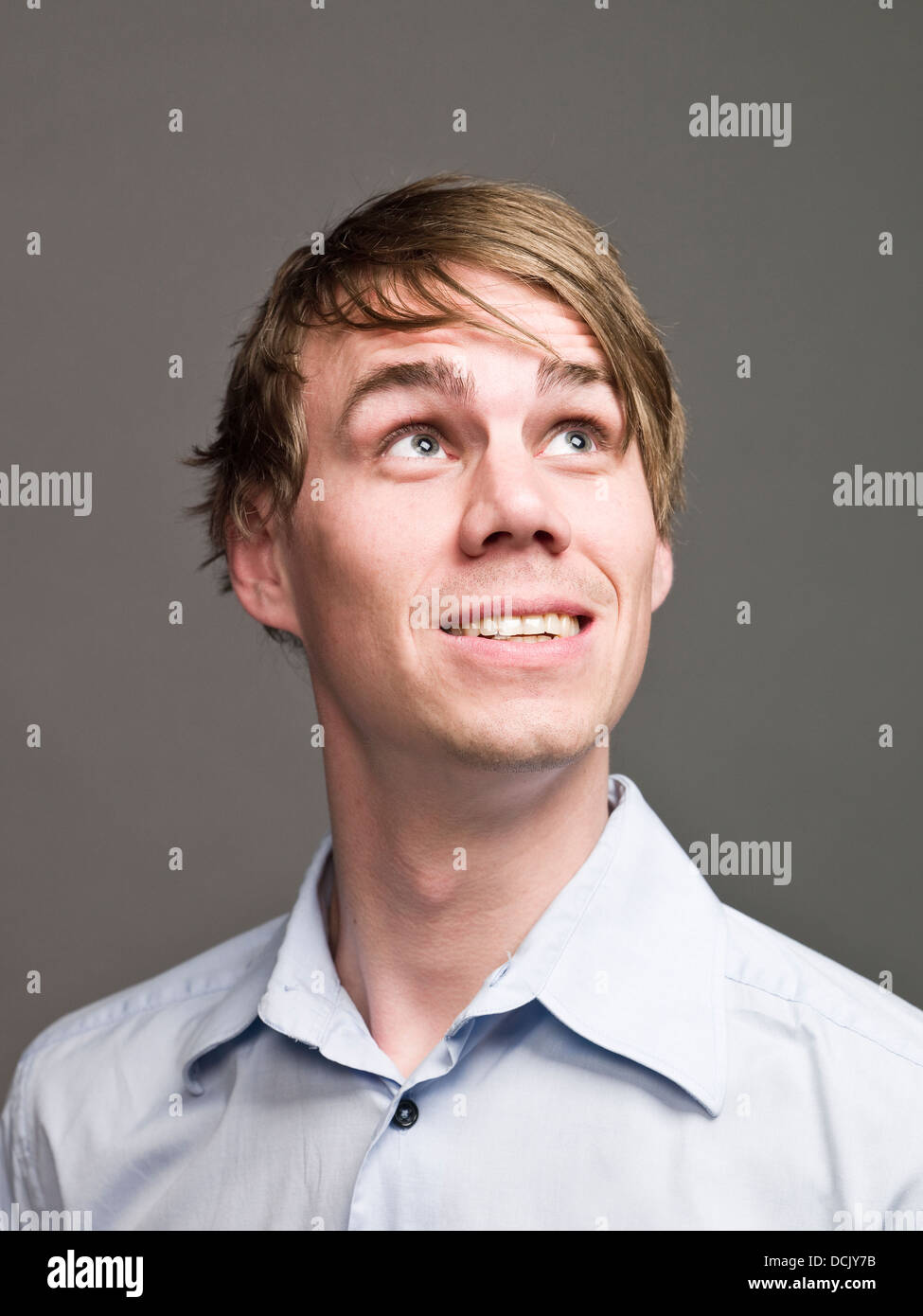 Portrait of a surprised man looking up Stock Photo - Alamy