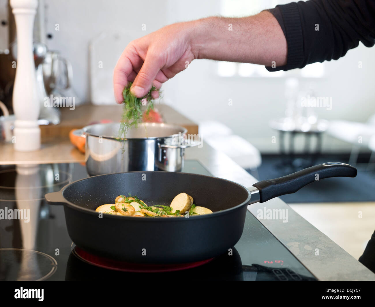 Man working with food in a elegant enviroment Stock Photo - Alamy
