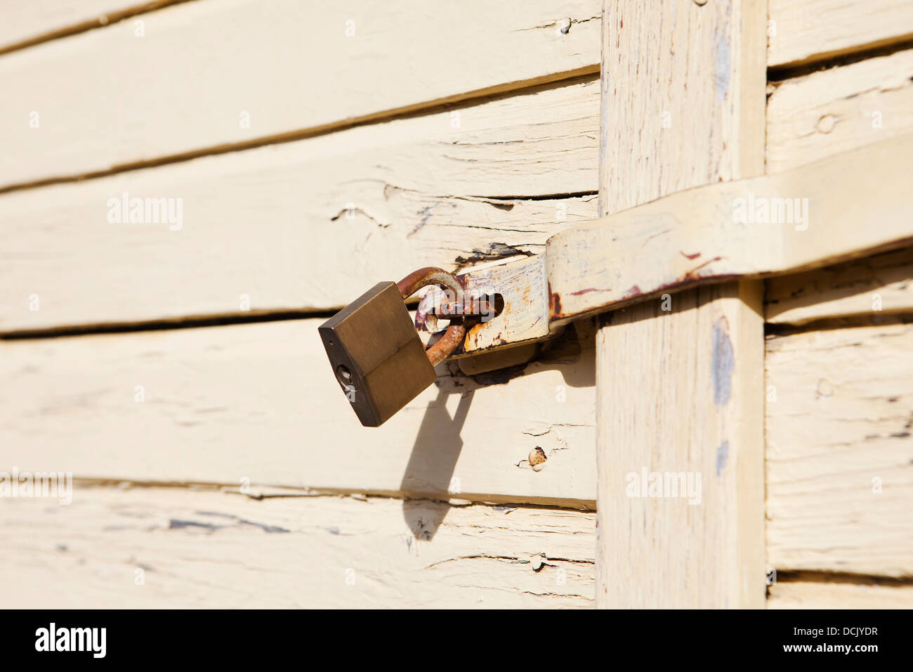 Lock on a worn door Stock Photo - Alamy