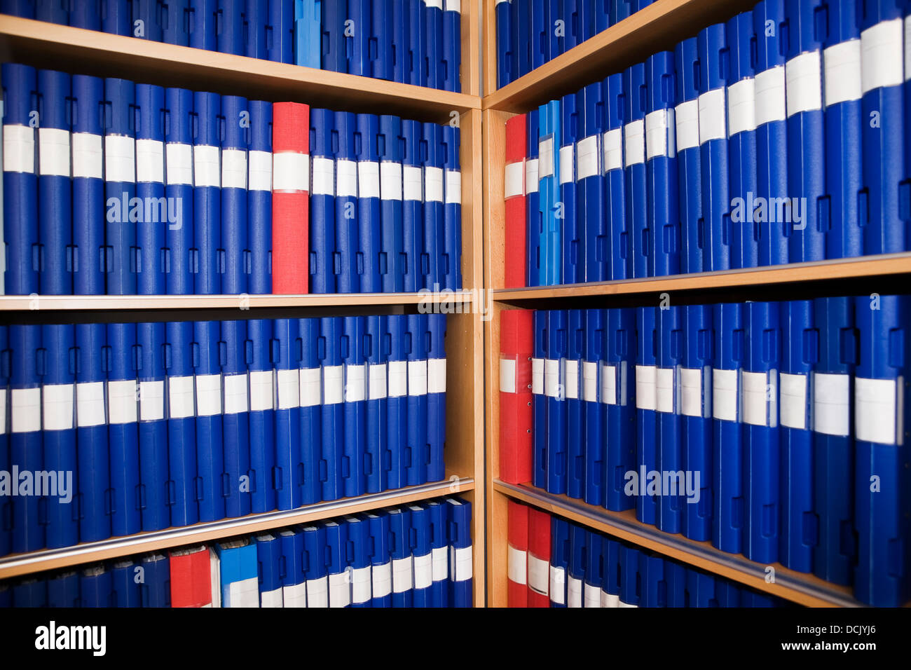 Several binders in a bookcase Stock Photo - Alamy