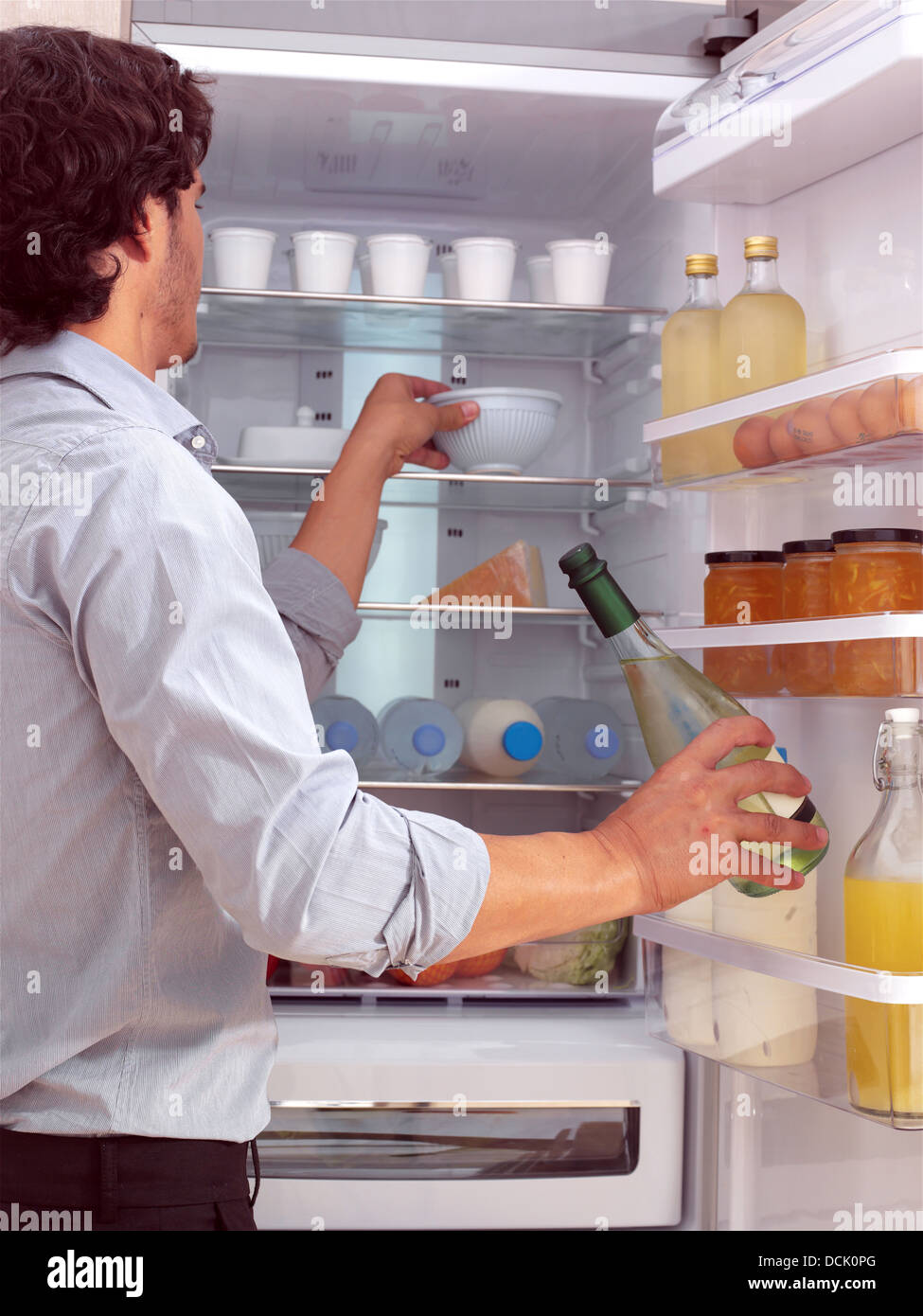 Man standing front fridge hi-res stock photography and images - Alamy