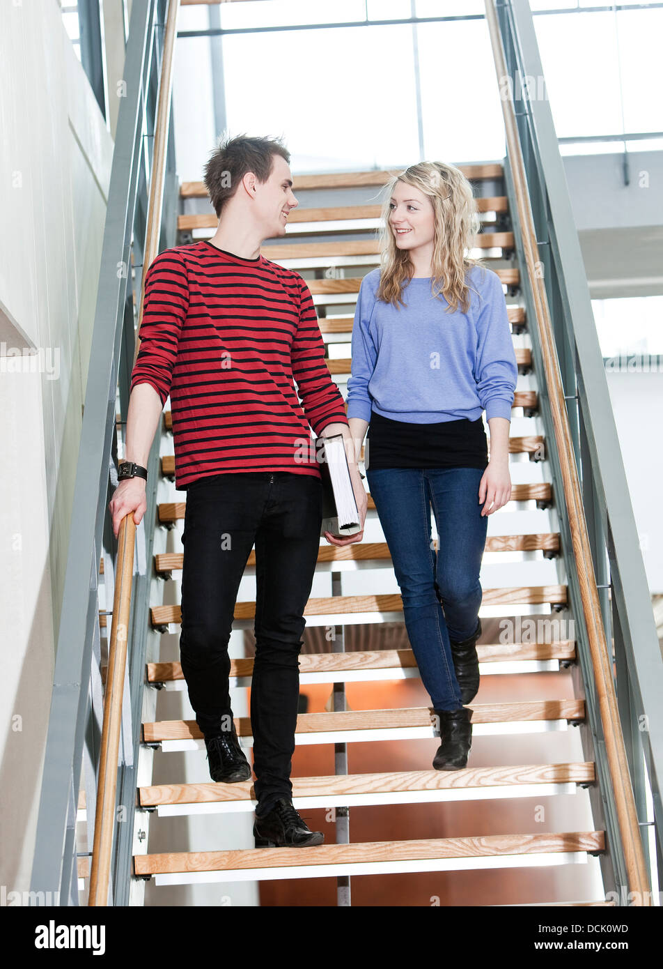 Couple walk the stairs Stock Photo - Alamy