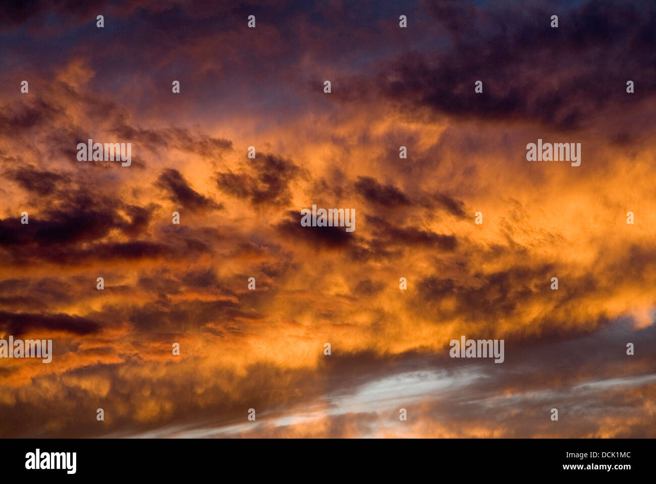 Red sky at night August sun setting under lit clouds. UK Stock Photo ...