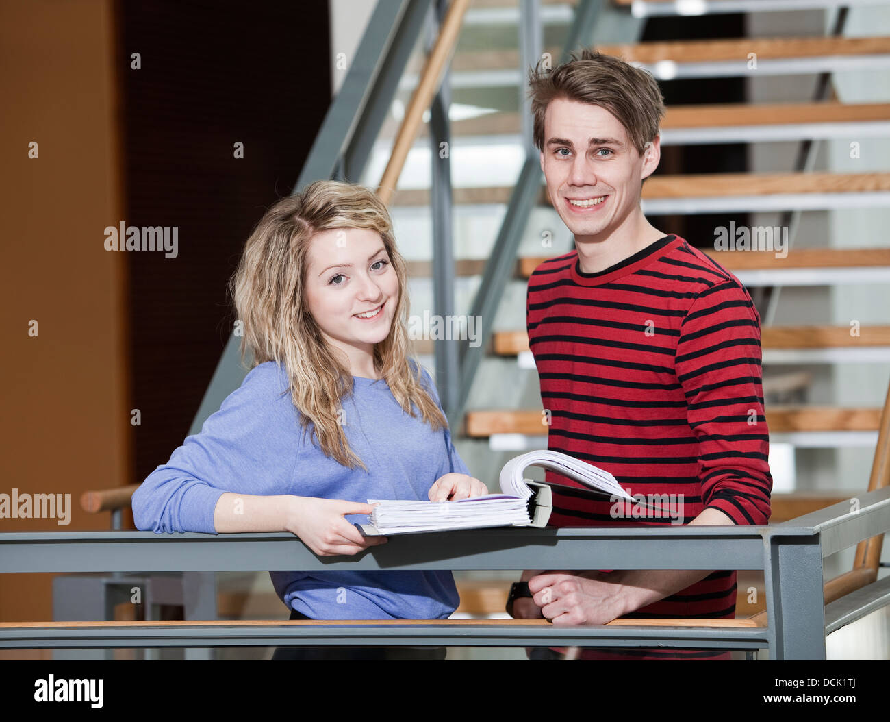 Couple with a binder Stock Photo - Alamy