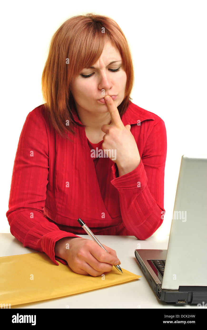 Office worker writes an address on an envelope Stock Photo - Alamy
