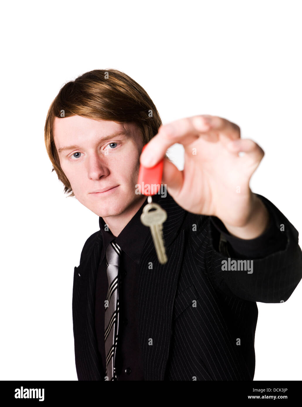 Man holding a key Stock Photo - Alamy