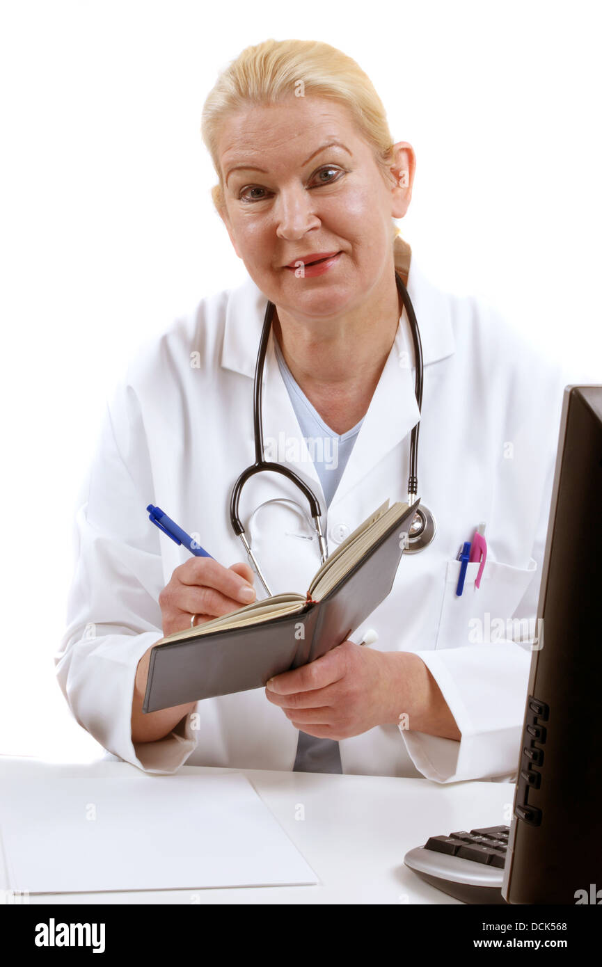 medical assistant takes notes in a book Stock Photo - Alamy