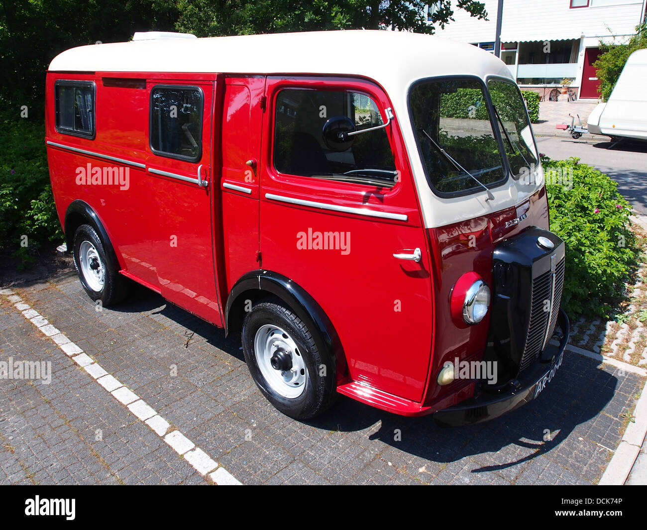 The Peugeot D4A, captured in Schoorl, is a vintage French delivery van ...