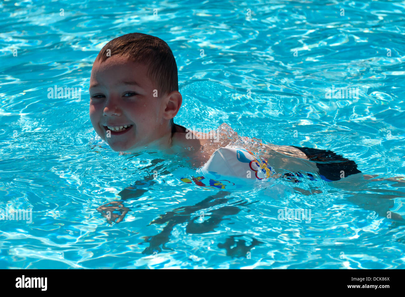 boy swimming in the pool Stock Photo - Alamy