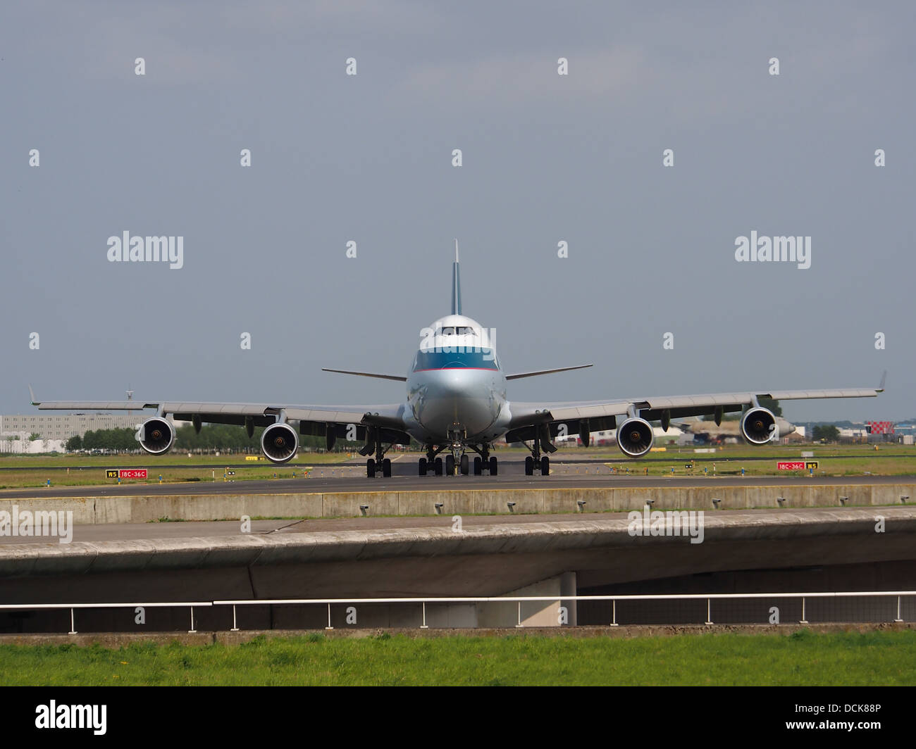 B-HUQ is a Cathay Pacific Boeing 747-467F, a large cargo aircraft ...