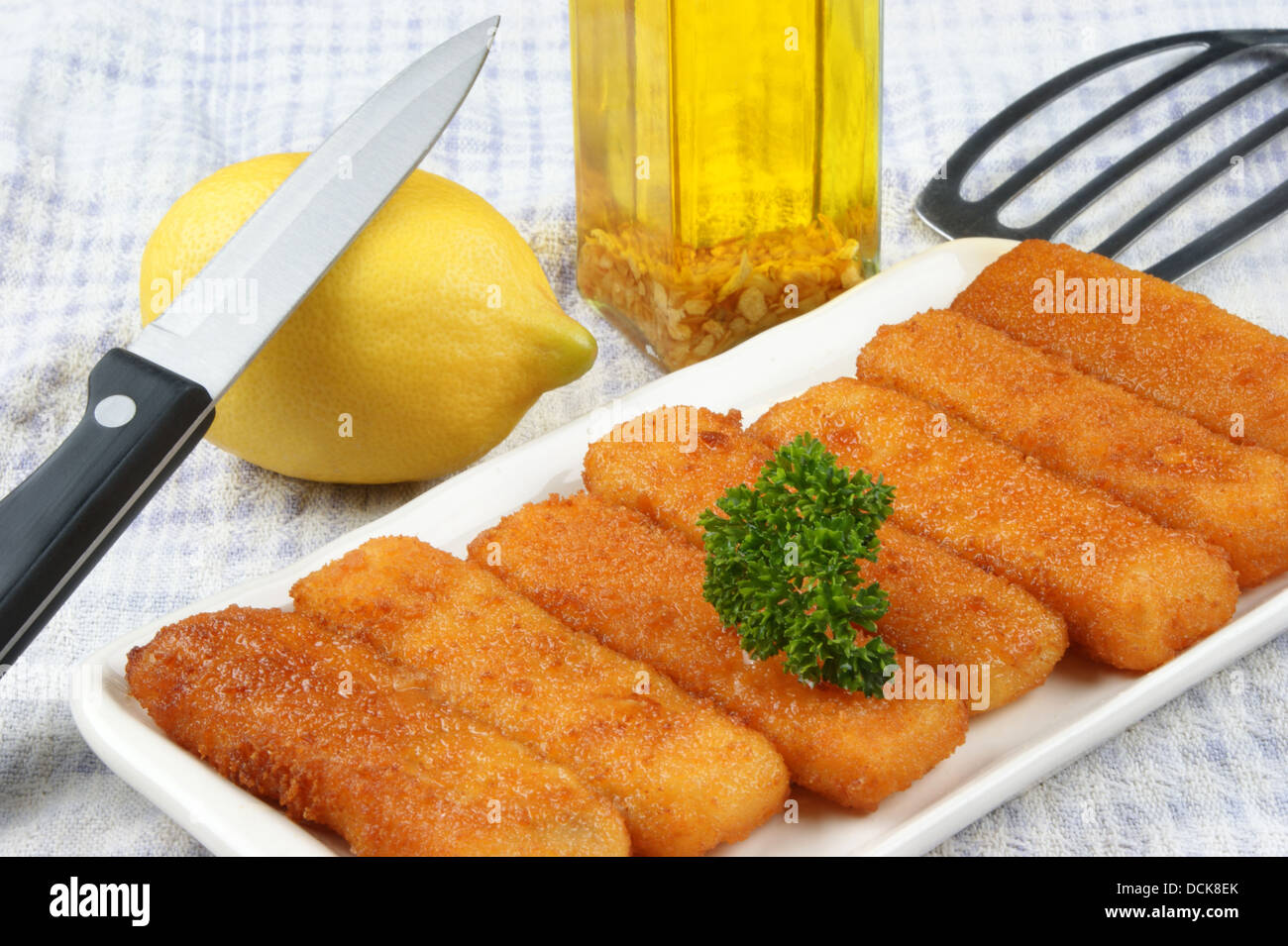 fried fish sticks on a white plate Stock Photo - Alamy