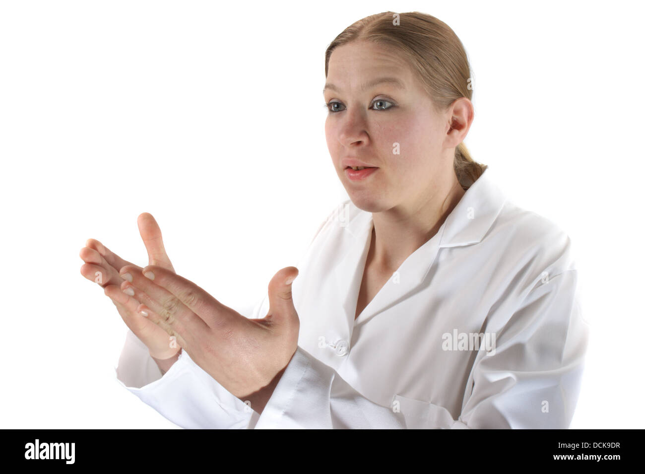 young medical assistant gesturing with both hands Stock Photo - Alamy