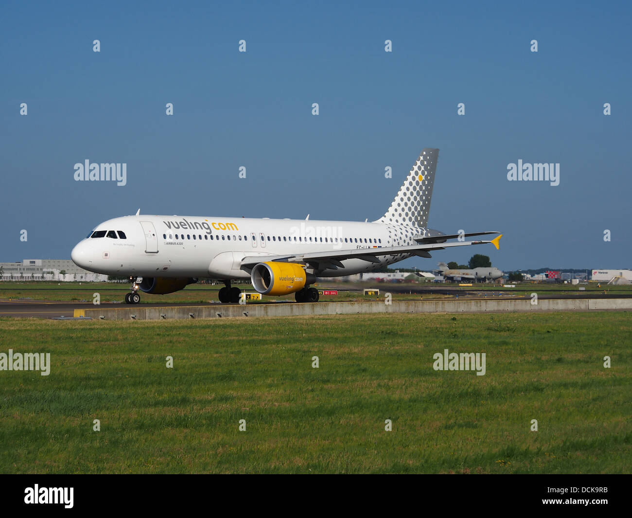 The Vueling Airbus A320-214, tail number EC-LLM, is seen taxiing at an ...