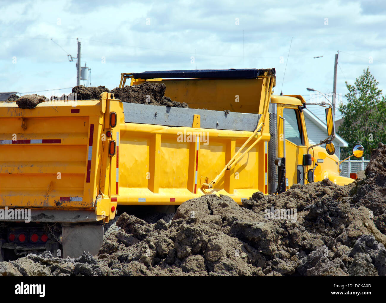 Yellow dump truck Stock Photo - Alamy
