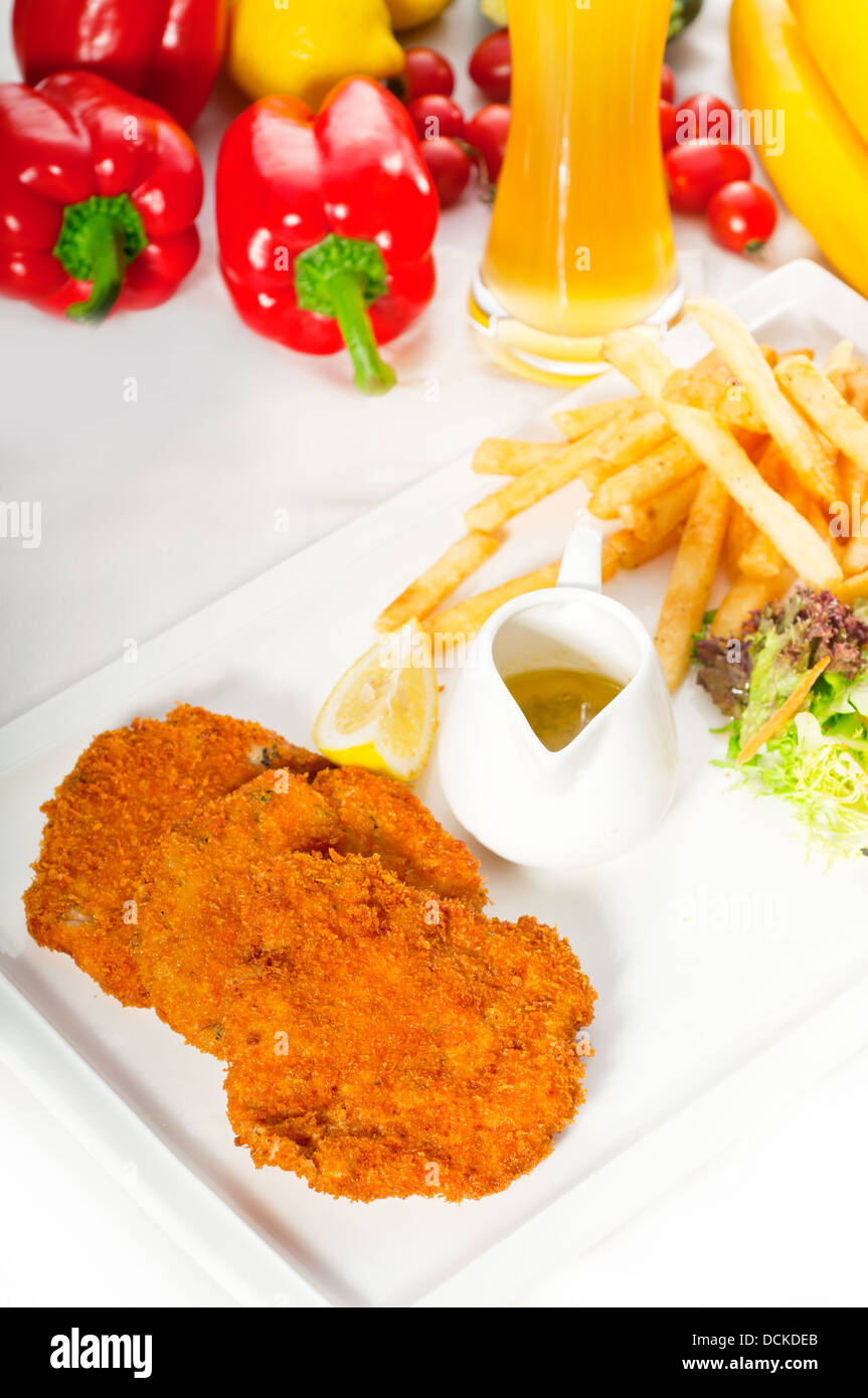 classic Milanese veal cutlets and vegetables Stock Photo - Alamy