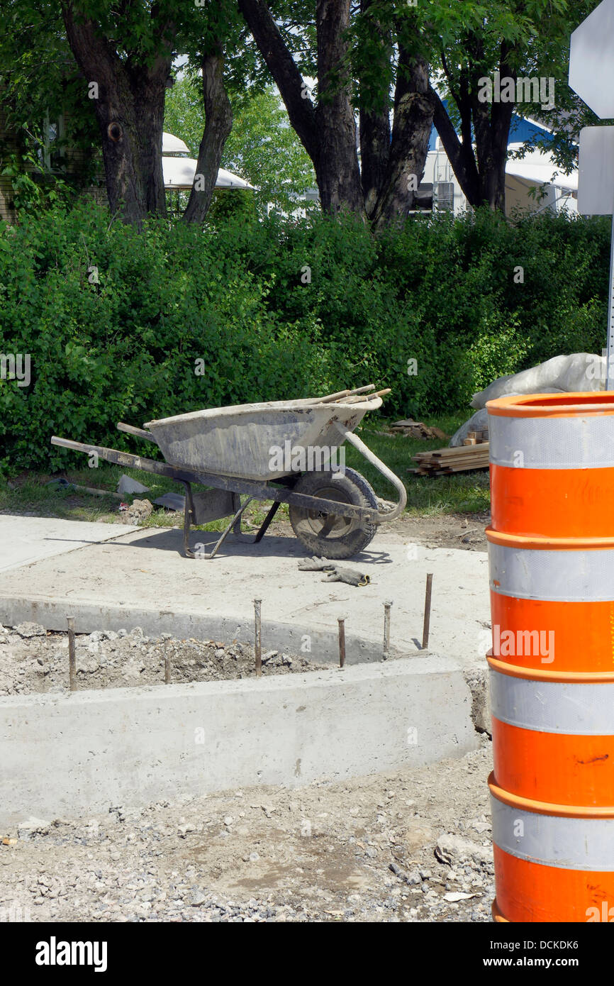 Wheelbarrow and street corner sidewalk Stock Photo - Alamy