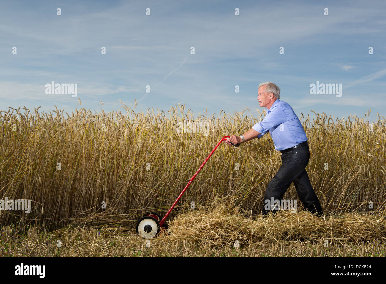 Businessman reaping the rewards Stock Photo - Alamy