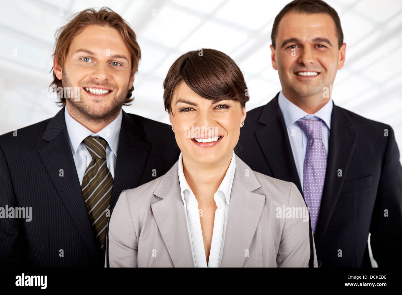 positive business team of three Stock Photo - Alamy
