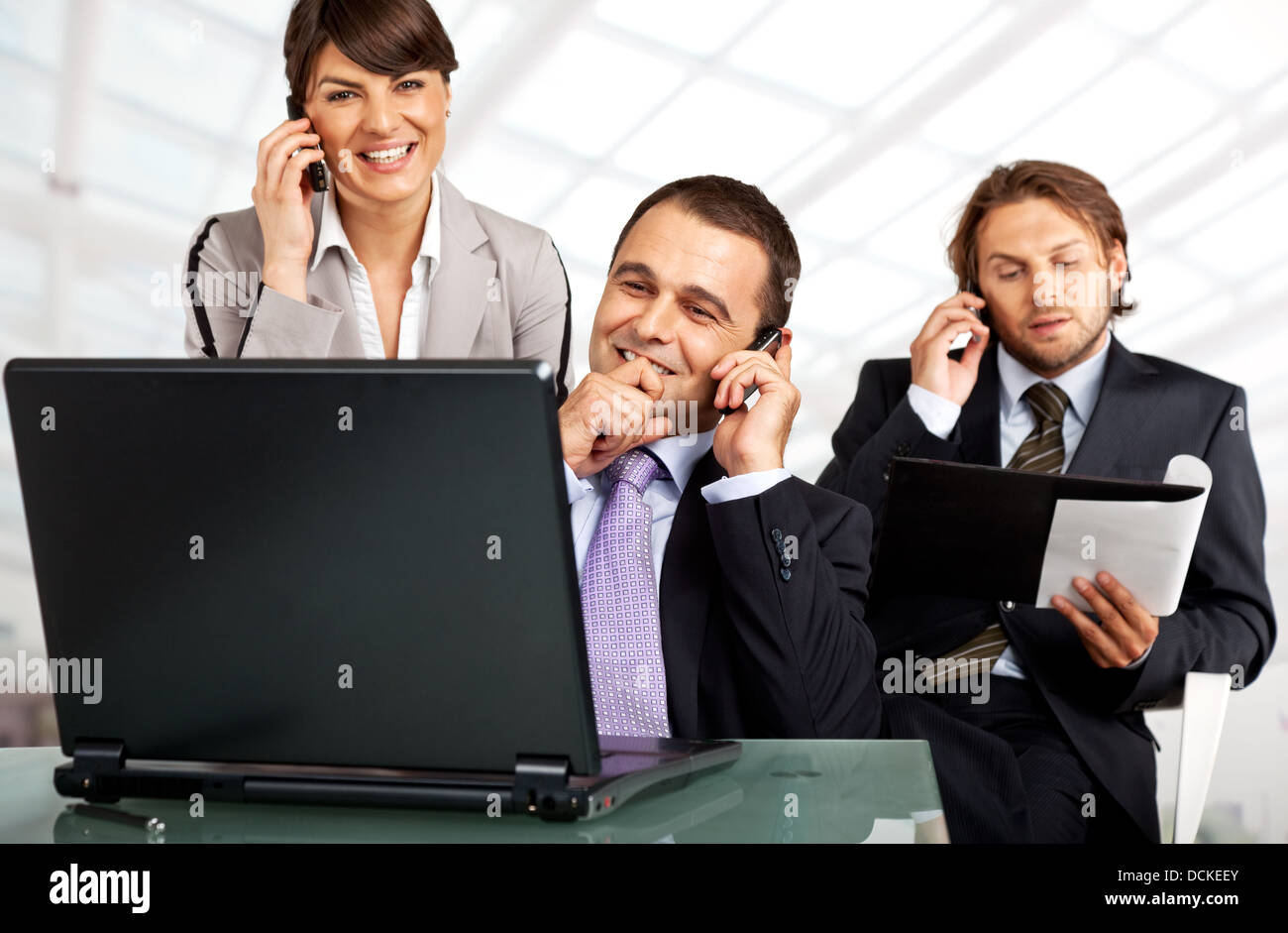 successful team phones and laptop Stock Photo - Alamy